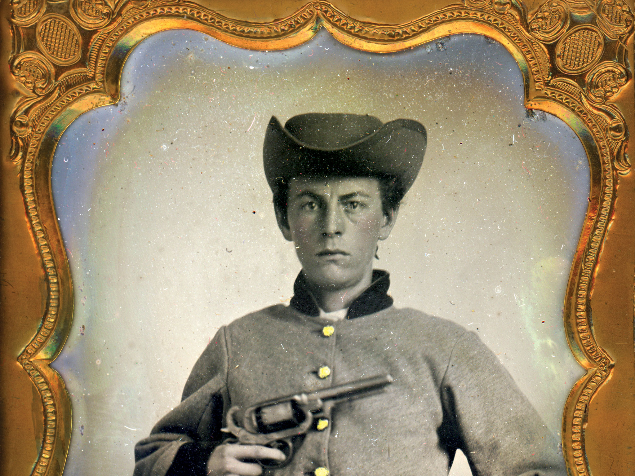 A Confederate soldier brandishes a Starr revolver