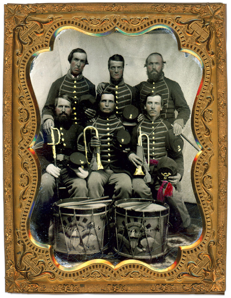 Civil War Union soldiers pictured with bugles and trumpets.