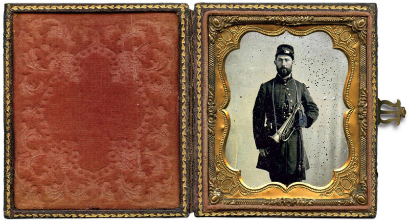 Civil War Union soldiers pictured with bugles and trumpets.