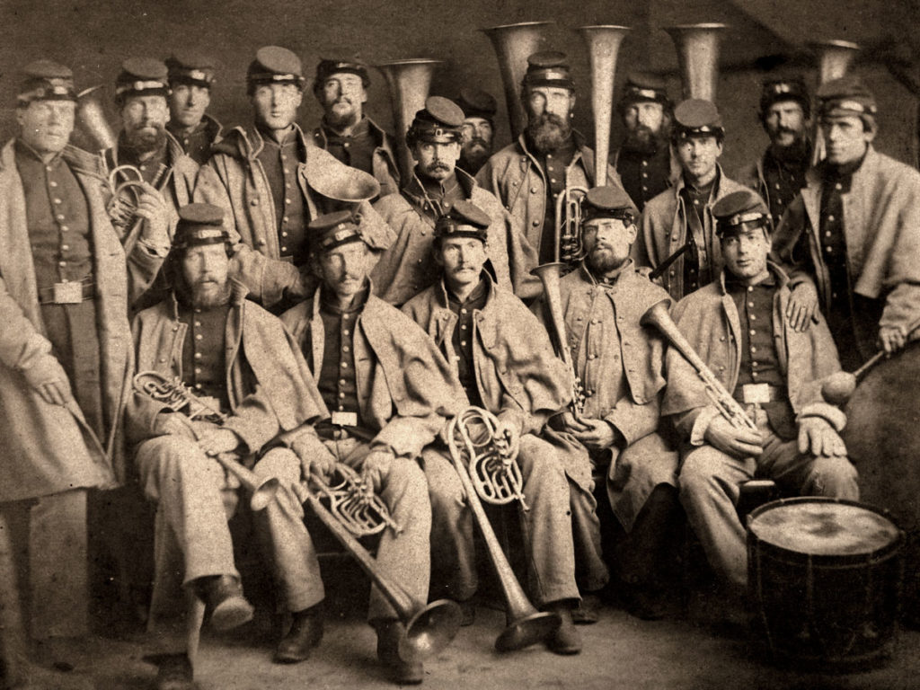 Civil War bandsmen pictured with cornets and saxhorns.