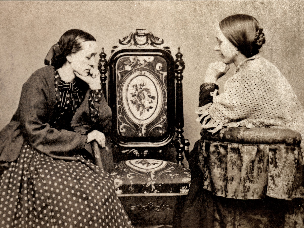 Civil War era portraits of people posed with empty chairs.