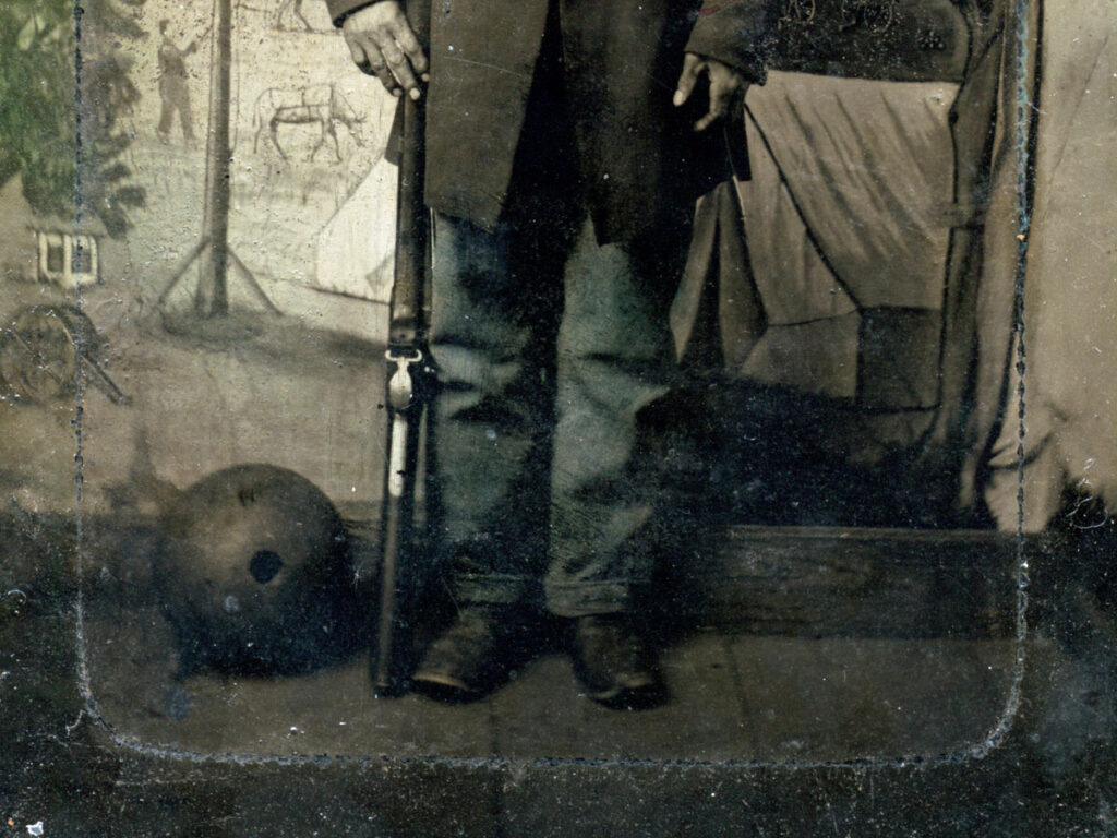 Civil War photographer William Kunstman, cannonball backdrop