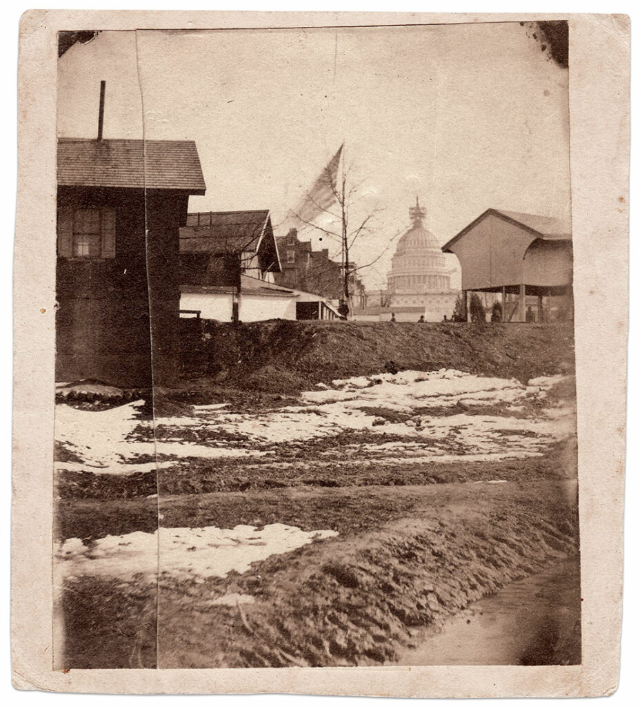 Civil War photographer William Kunstman, cannonball backdrop